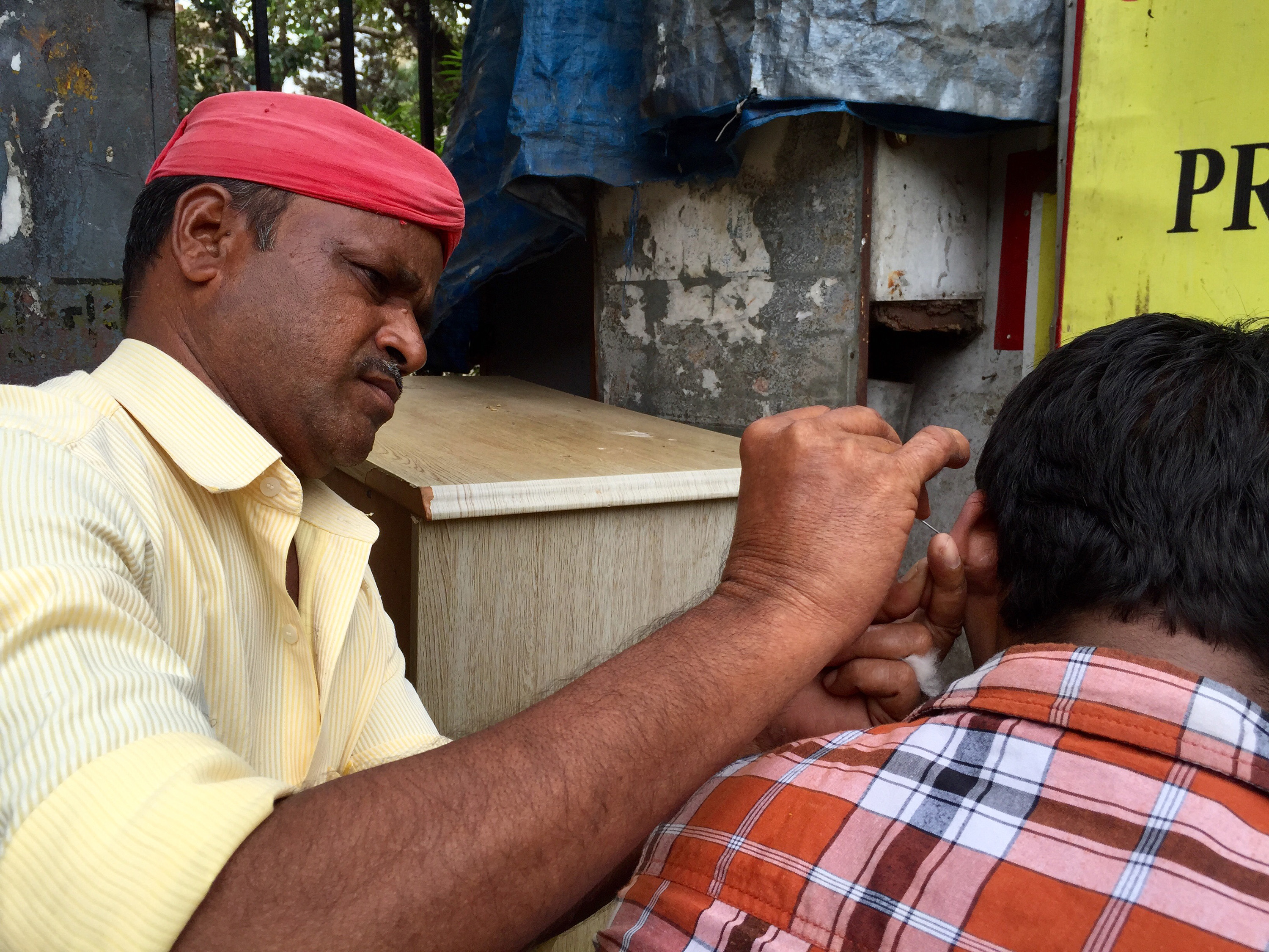 In India, workers clean people's ears, but customers are getting scarcer