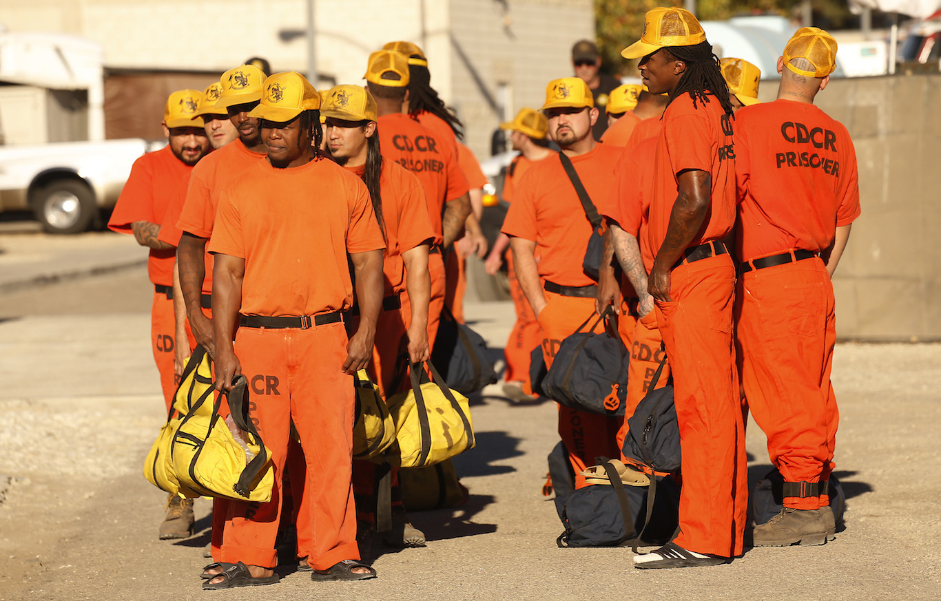 Prisoner firefighters risk lives in blaze for low pay and early releases