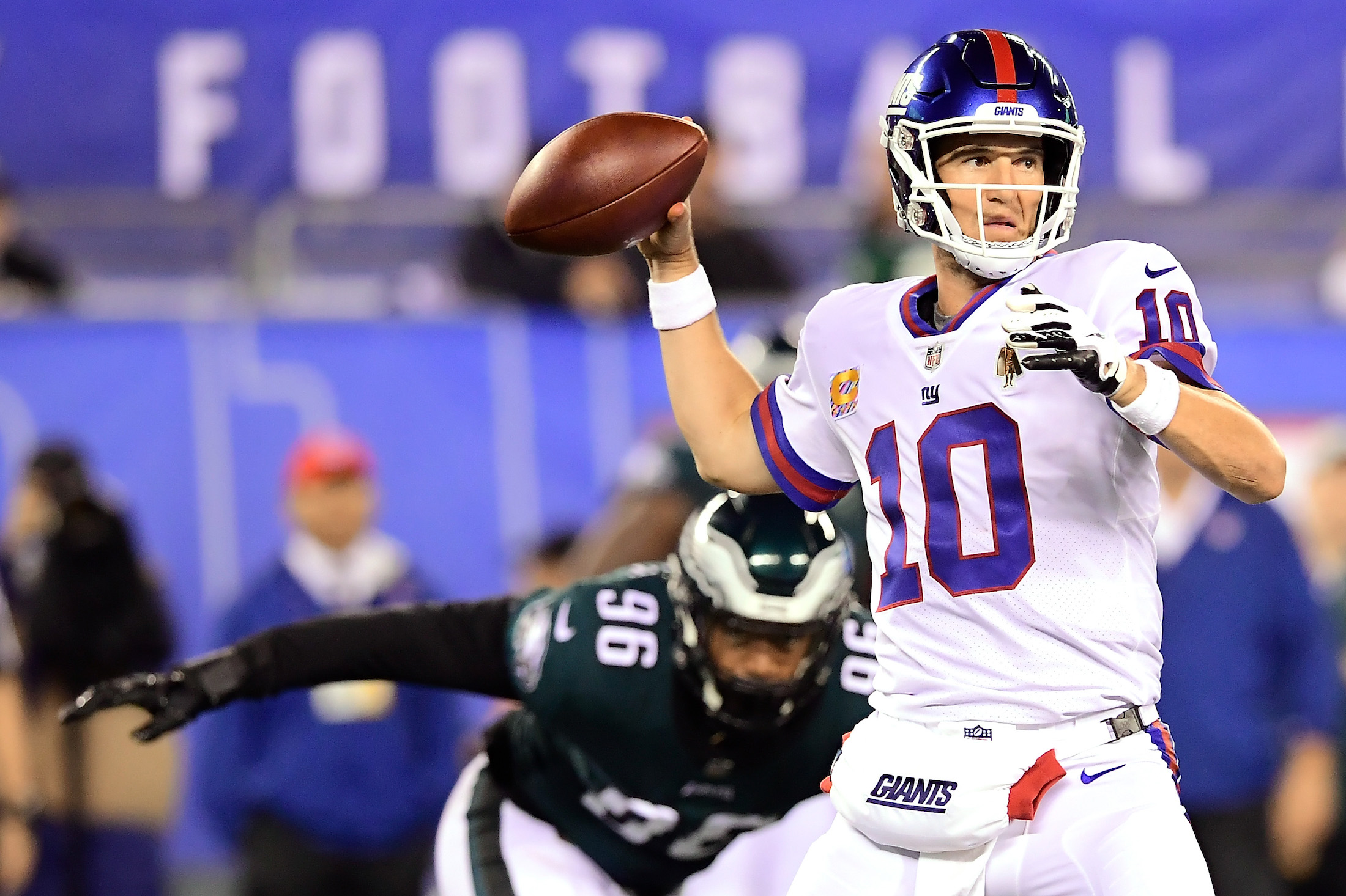 Kids learn finances with help from pro quarterback Eli Manning
