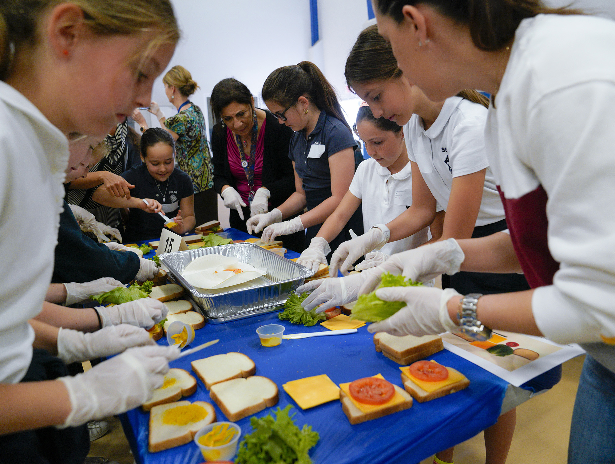 Students try to break sandwich-making record while feeding those in need